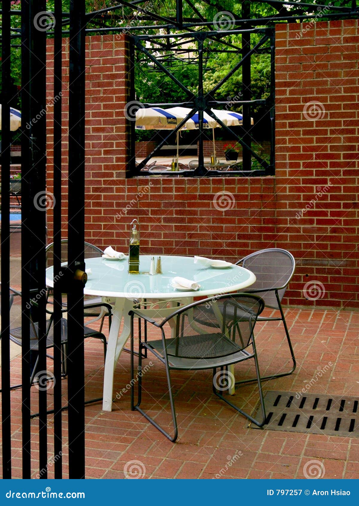 Secluded Cyan Dining Table and Chairs Stock Image - Image of gate ...