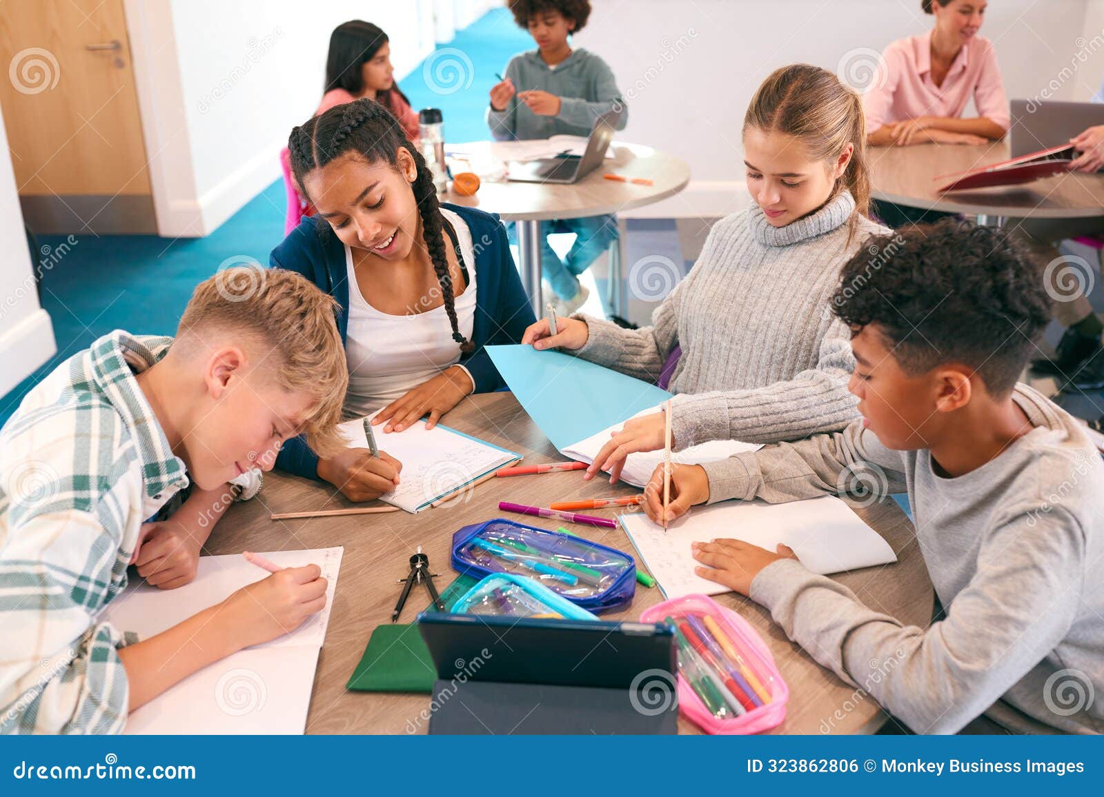 Secondary or High School Students Collaborating in Study Area with ...