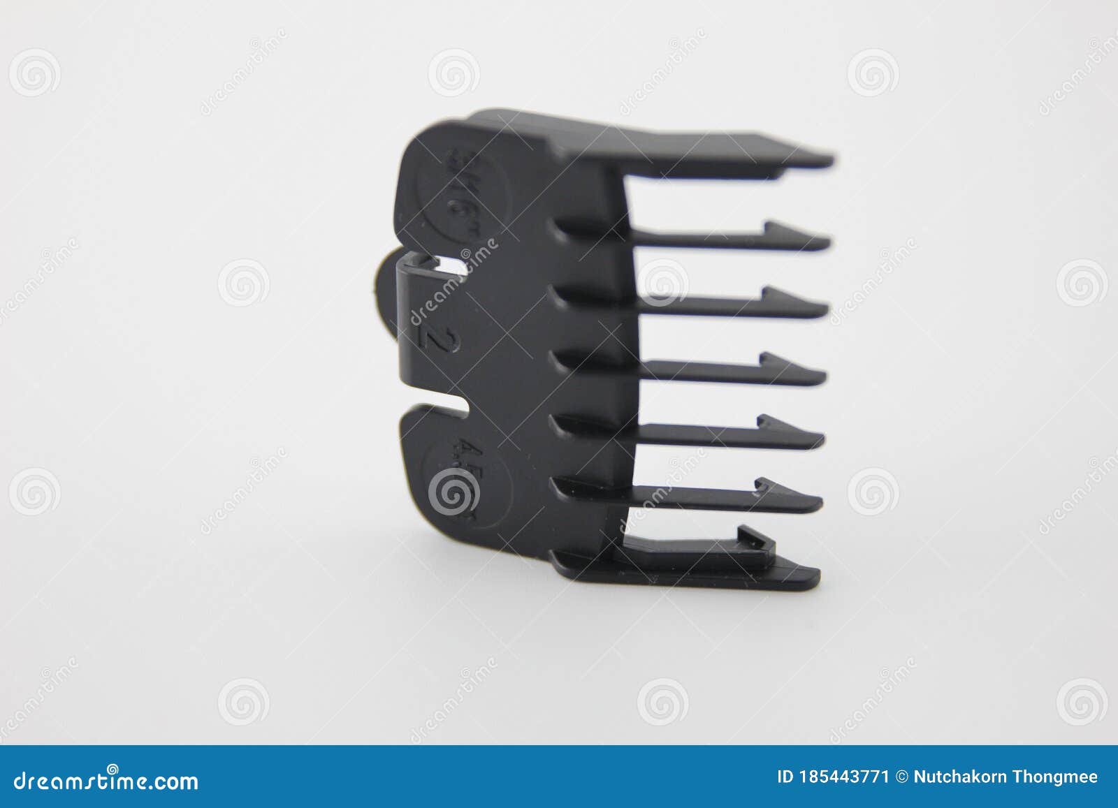 Secondary Teeth for Use with the Clipper Placed on a Gray Background ...