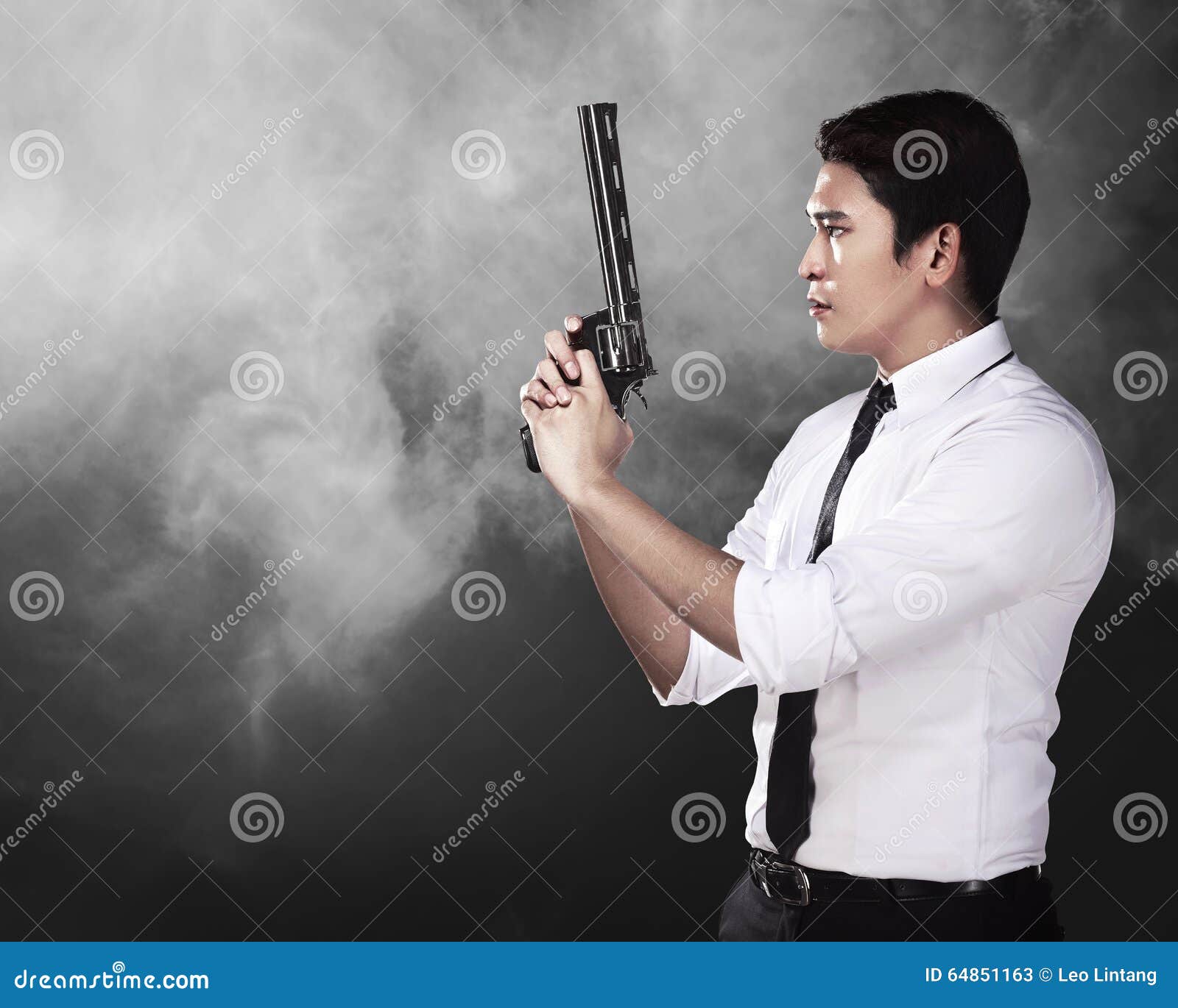 Secret Agent Holding Gun stock image. Image of professional - 64851163