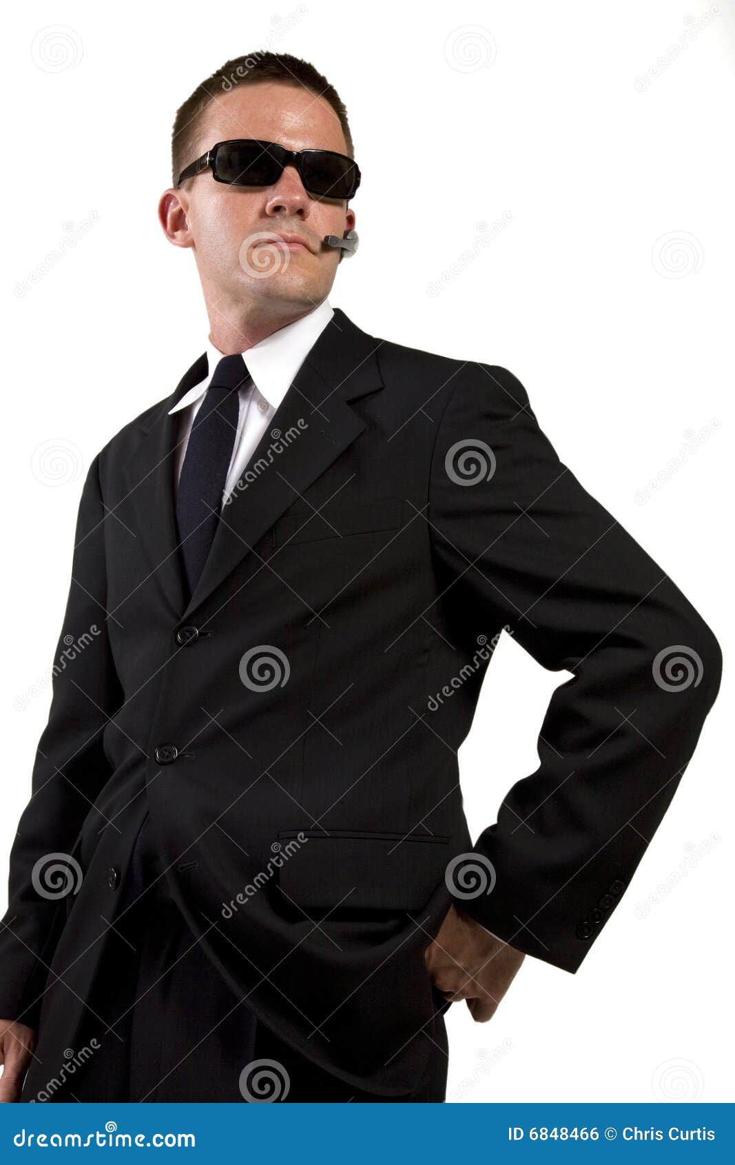 Secret Agent Reaches for Gun Stock Photo - Image of headset ...