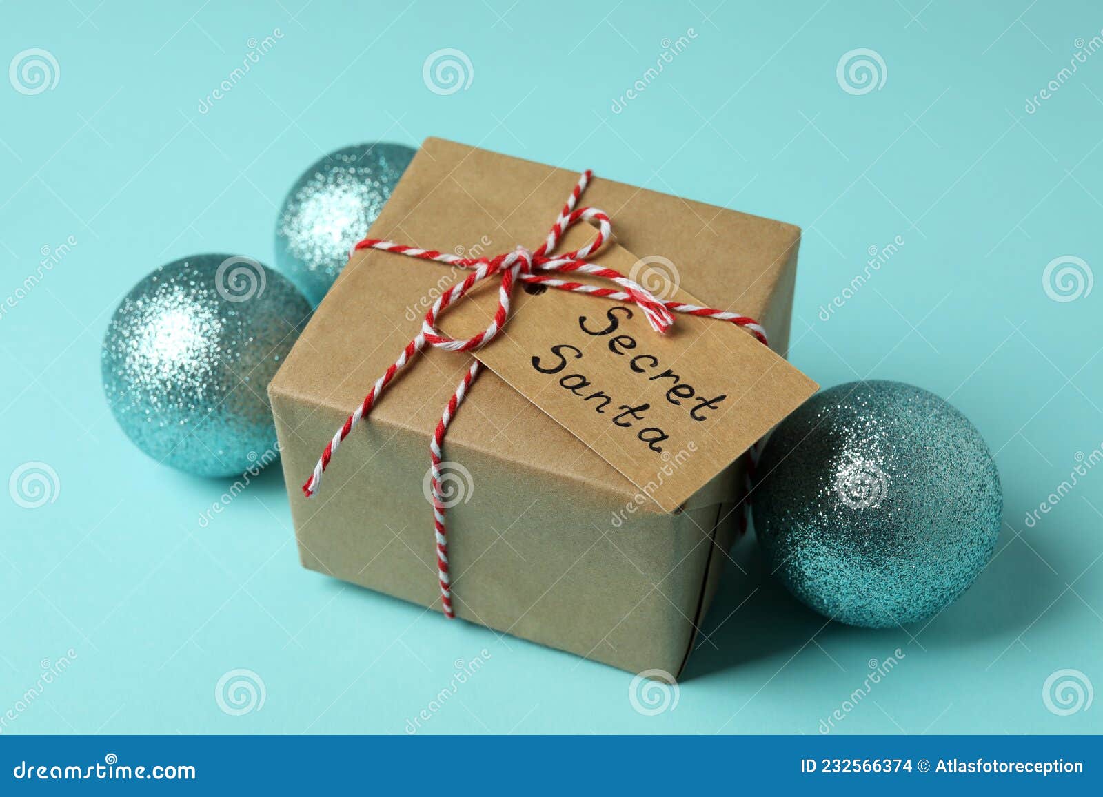 Secret Santa Gift Box with Baubles on Blue Background Stock Photo ...