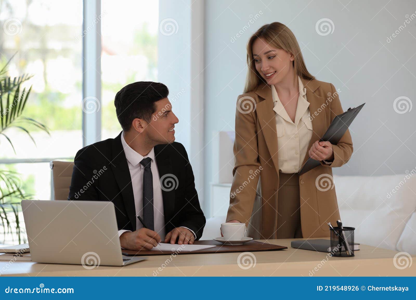 Secretary Bringing Coffee To Her Boss in Office Stock Photo - Image of ...