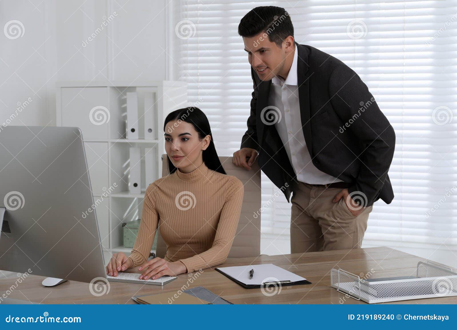 Secretary and Her Boss Working at Table in Office Stock Photo - Image ...