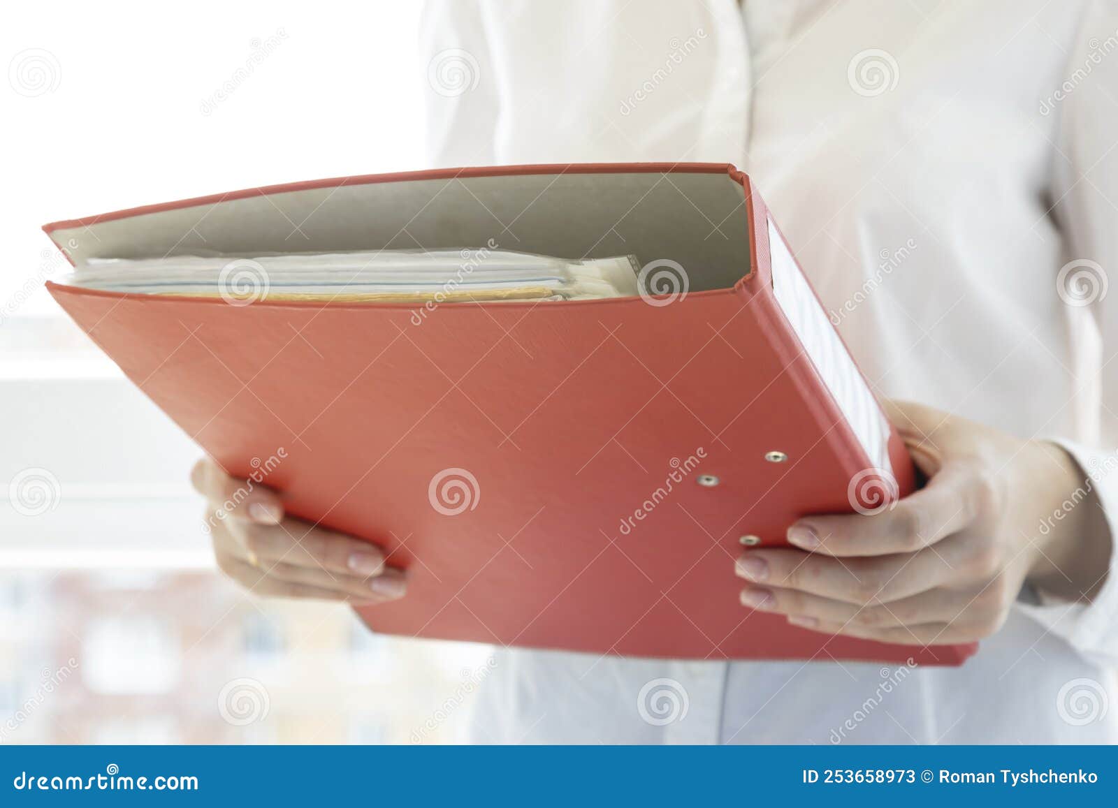 The Secretary is Holding a Red Folder. Stock Image - Image of ...