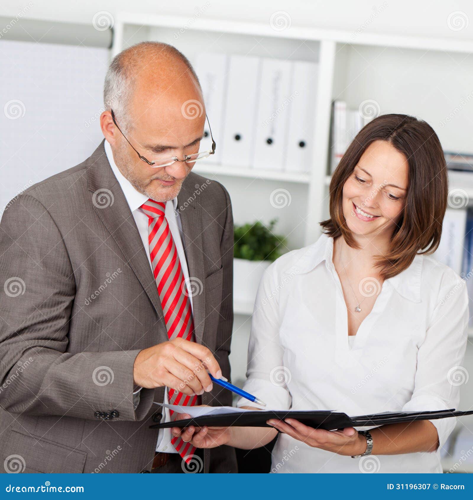 Secretary presenting file stock image. Image of confident - 31196307