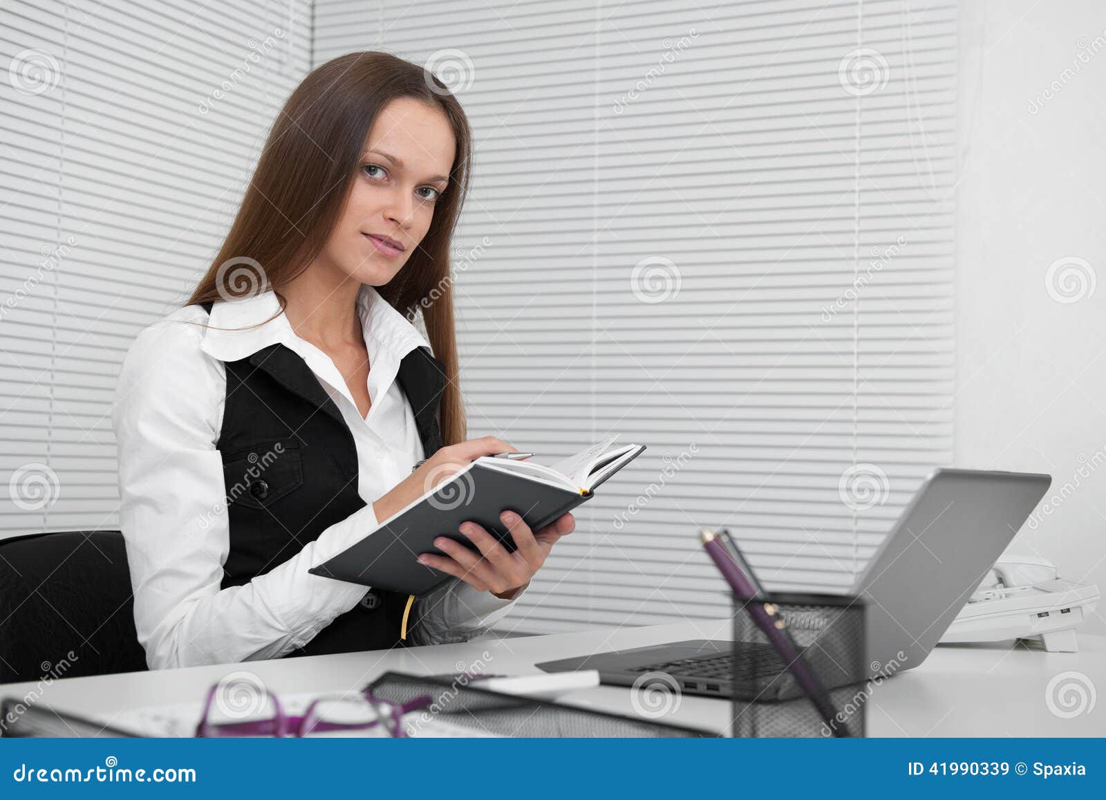 Secretary sitting at desk stock image. Image of person - 41990339