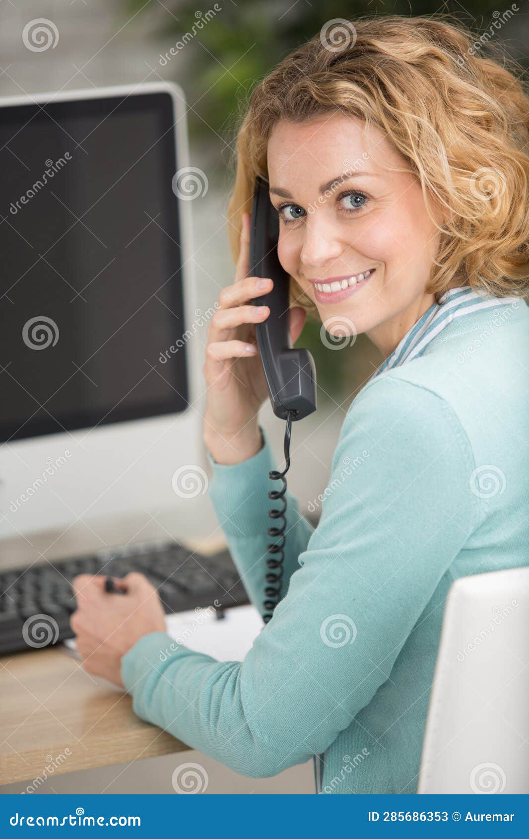 Secretary on Telephone Looking Over Shoulder Stock Image - Image of ...