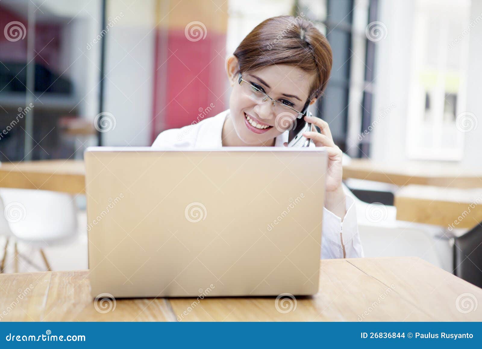 Secretary Using Cellphone with Laptop Stock Photo - Image of beautiful ...