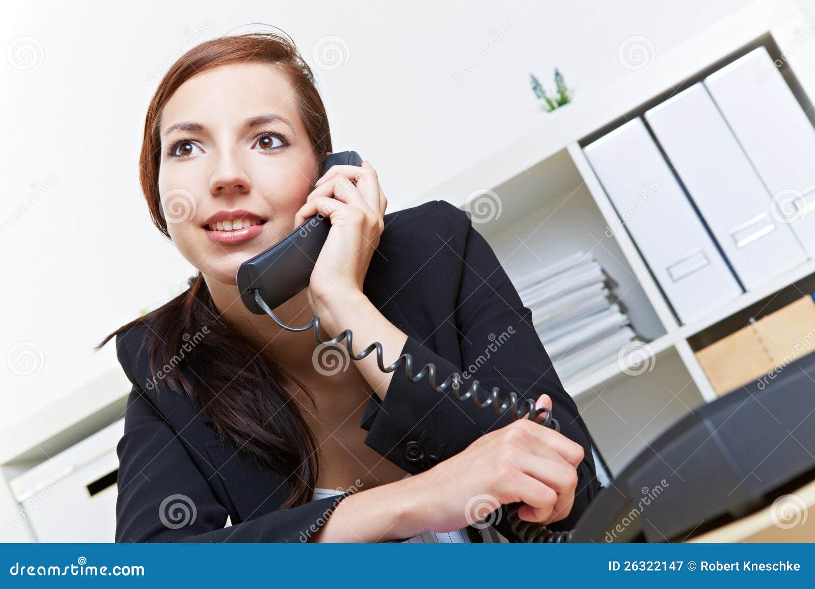 Secretary Using Phone in Office Stock Image - Image of customer ...