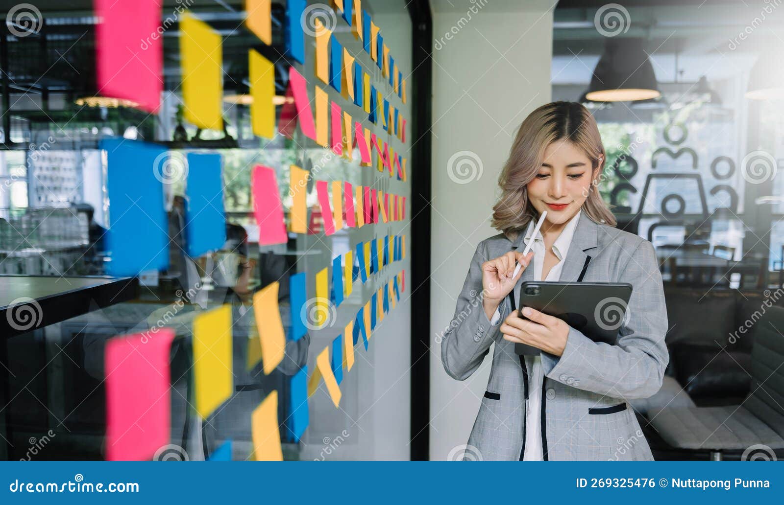 Secretary Working in Modern Office in Skyscraper, Writing and Sticking ...
