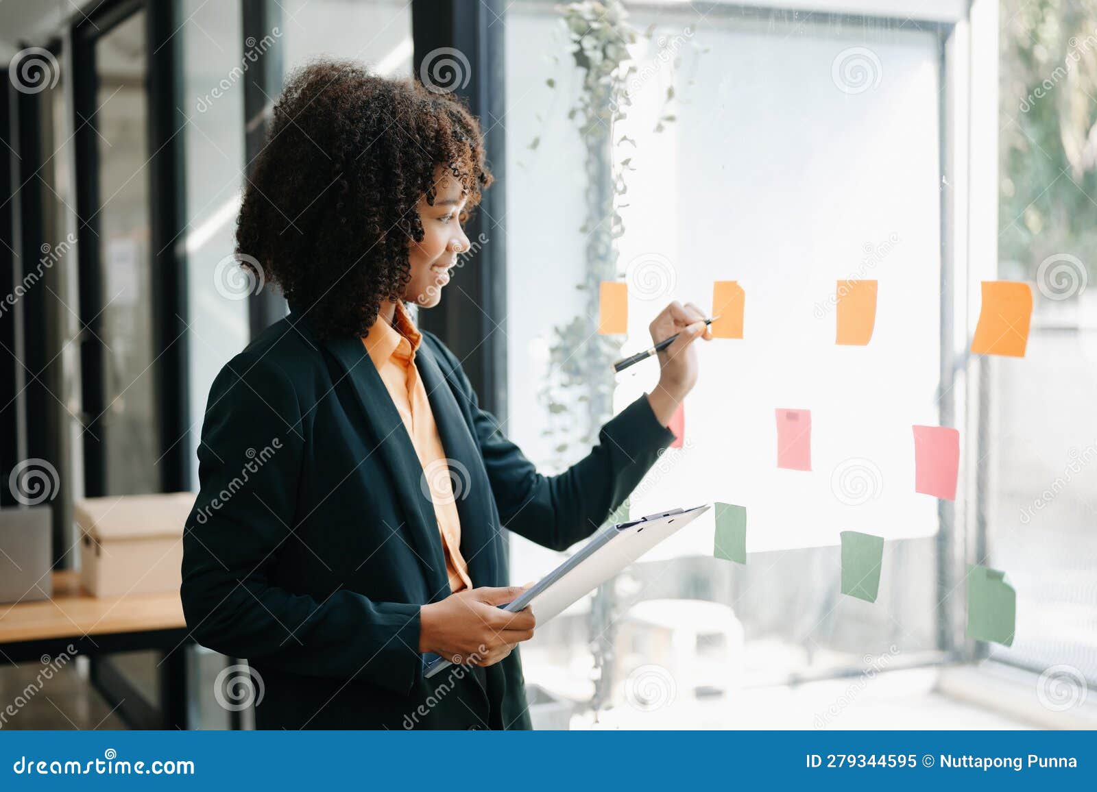 Secretary Working in Modern Office in Skyscraper, Writing and Sticking ...