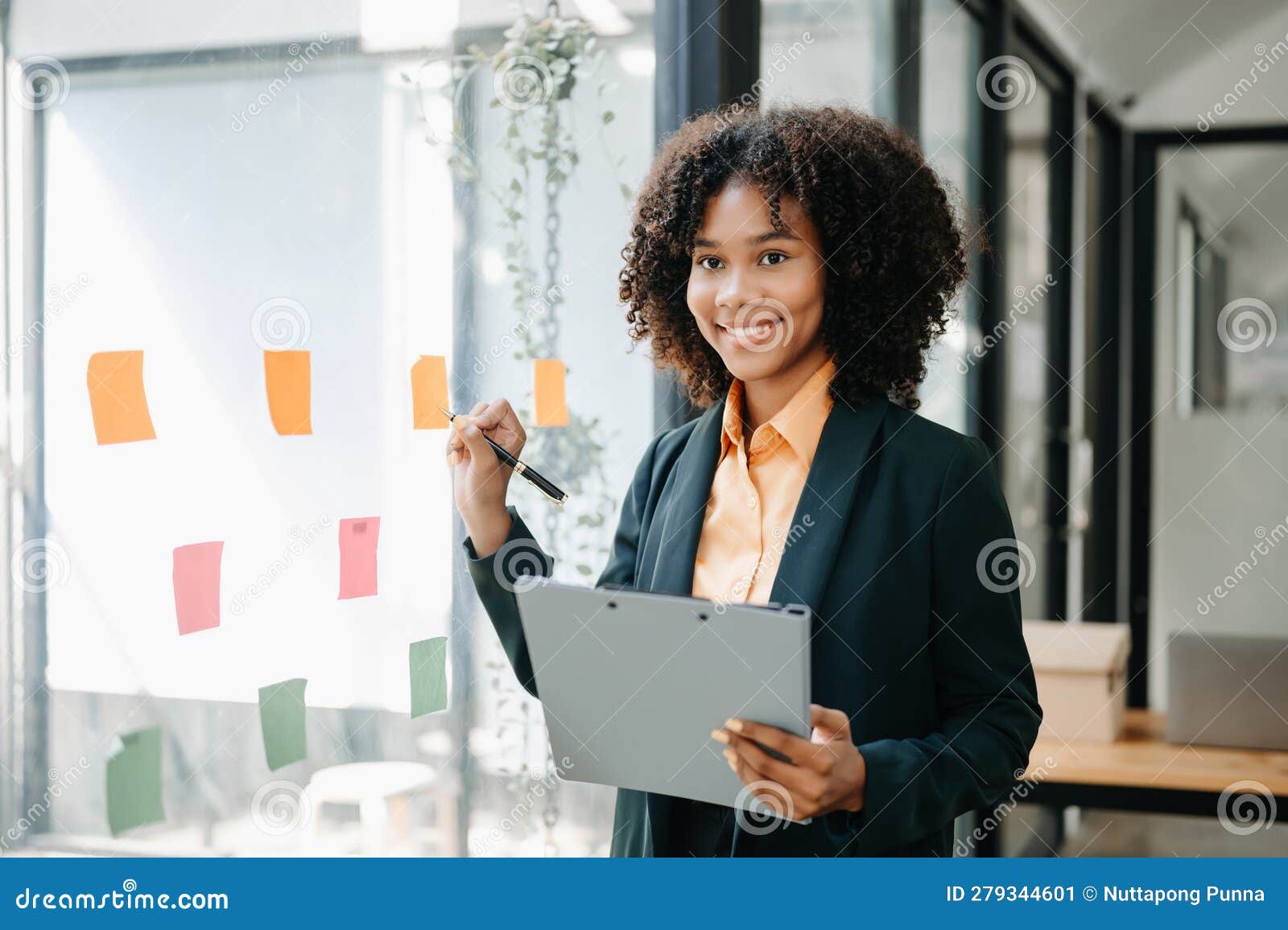 Secretary Working in Modern Office in Skyscraper, Writing and Sticking ...