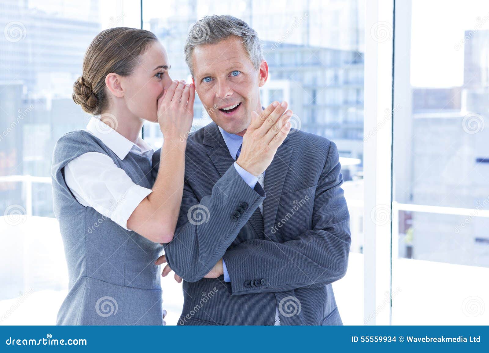 Secretive Business Colleagues Whispering Stock Photo - Image of ...