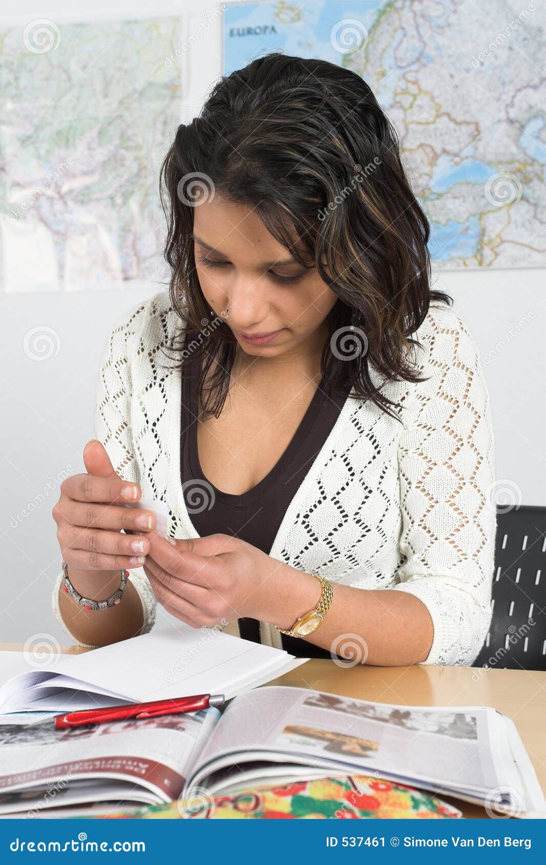 Secretly checking the note stock image. Image of learn - 537461