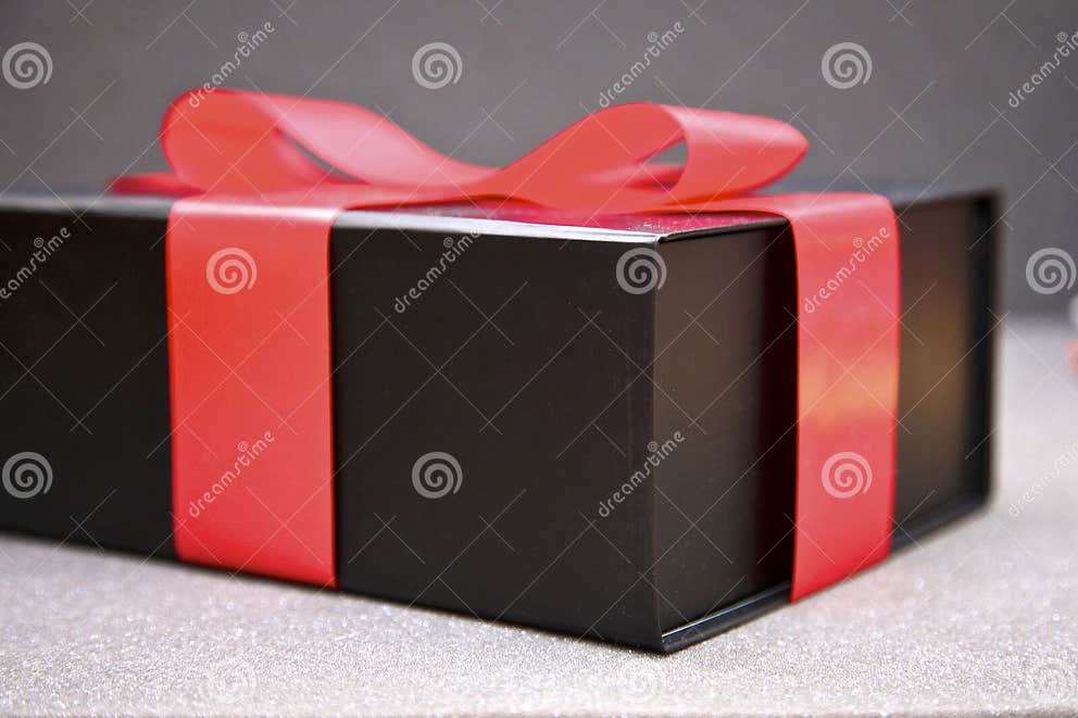 Black box and red ribbon stock photo. Image of gift - 197054912