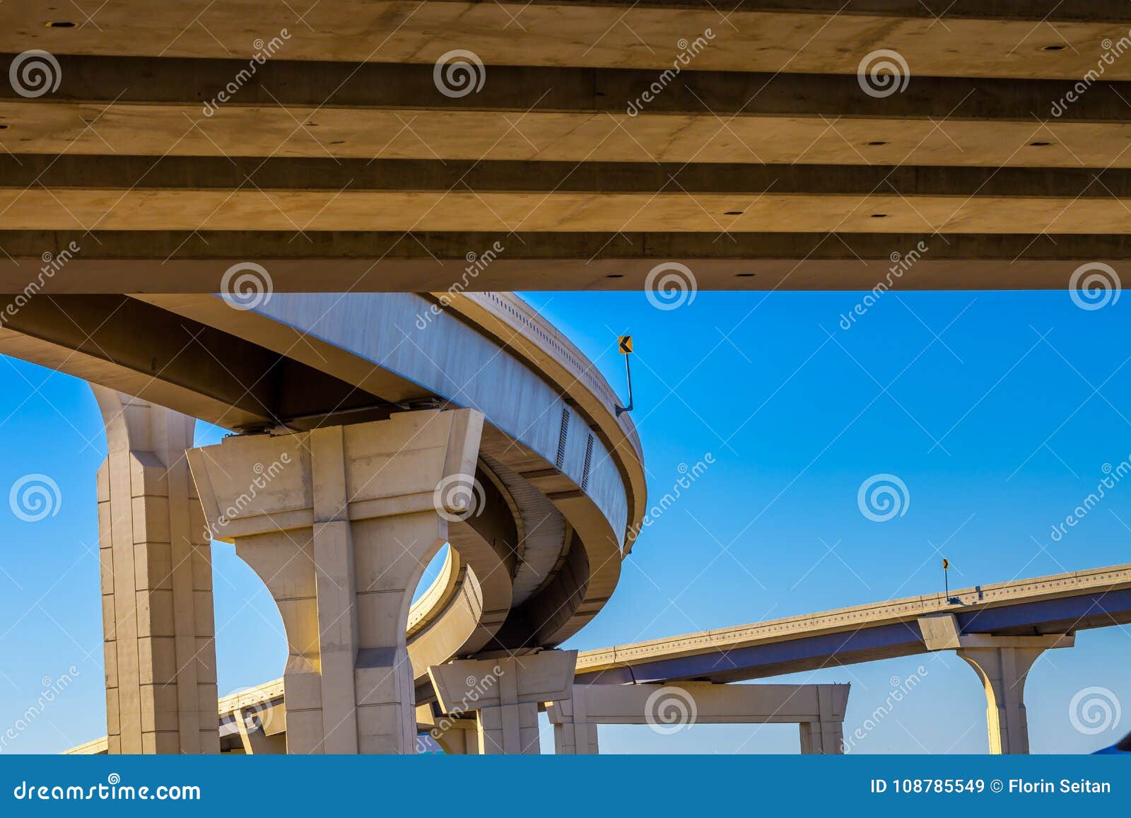 Section of Elevated Highway with Several Levels Against a Bright Blue ...