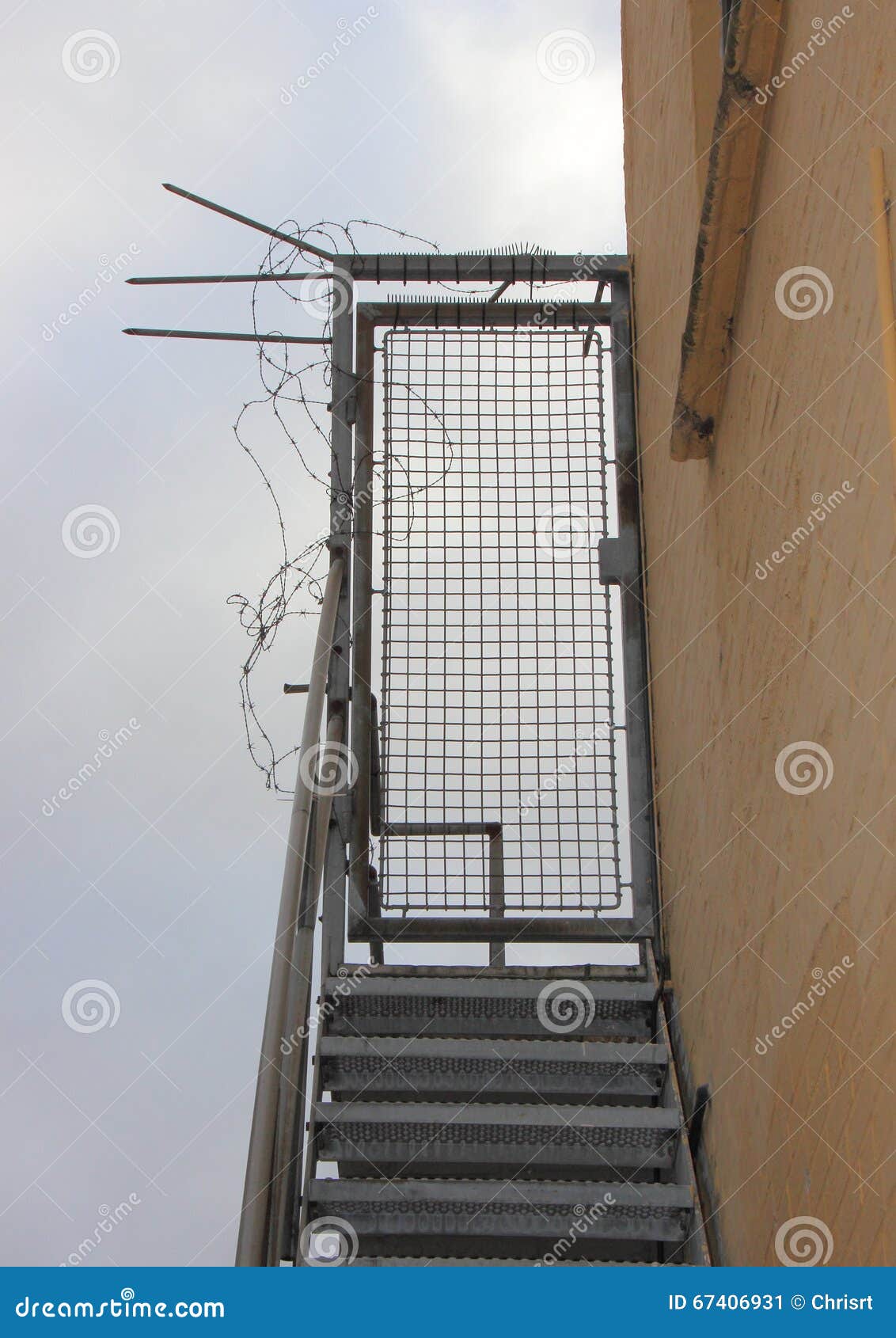 Secure Staircase with Iron Grid and Barbed Wire Stock Image - Image of ...