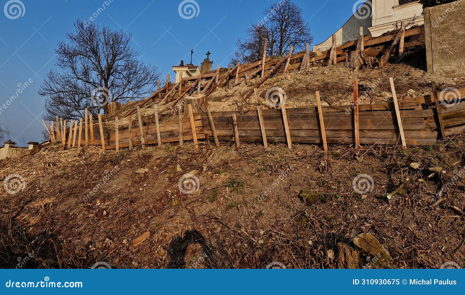 Securing the Slope Against Erosion. the Repair of the Cemetery Wall is ...