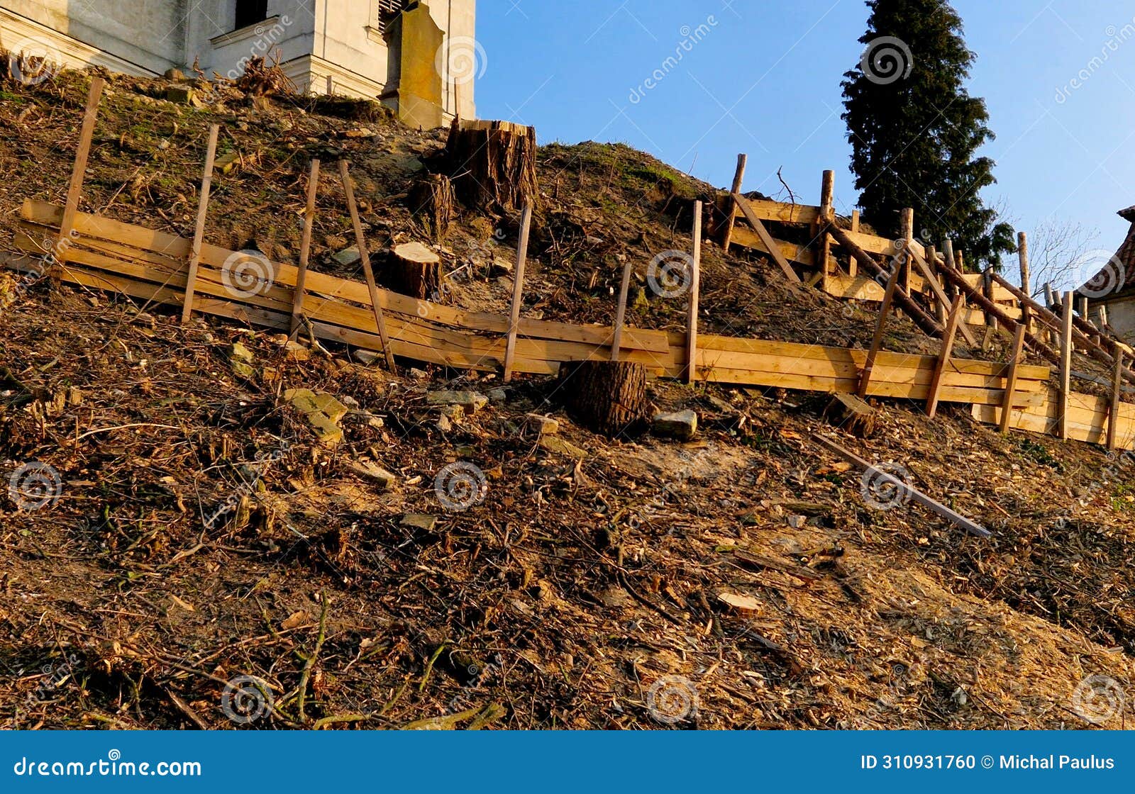 Securing the Slope Against Erosion. the Repair of the Cemetery Wall is ...