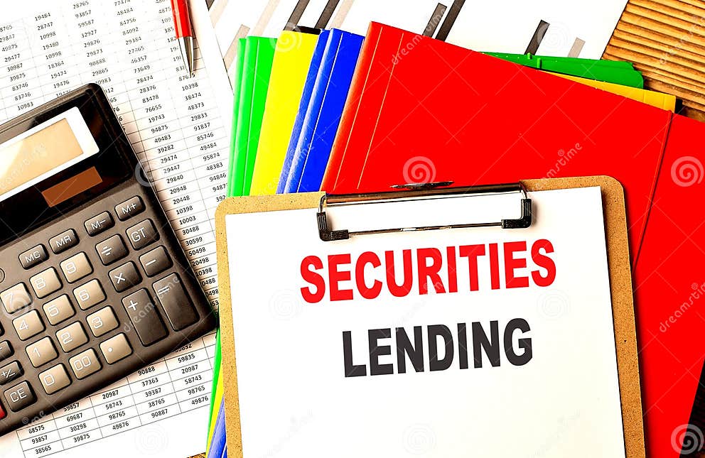 SECURITIES LENDING Text on Clipboard with Calculator and Color Folder ...