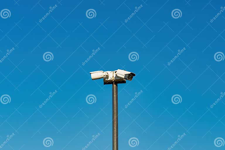 Security Camera or CCTV on Blue Sky Background. Stock Photo - Image of ...