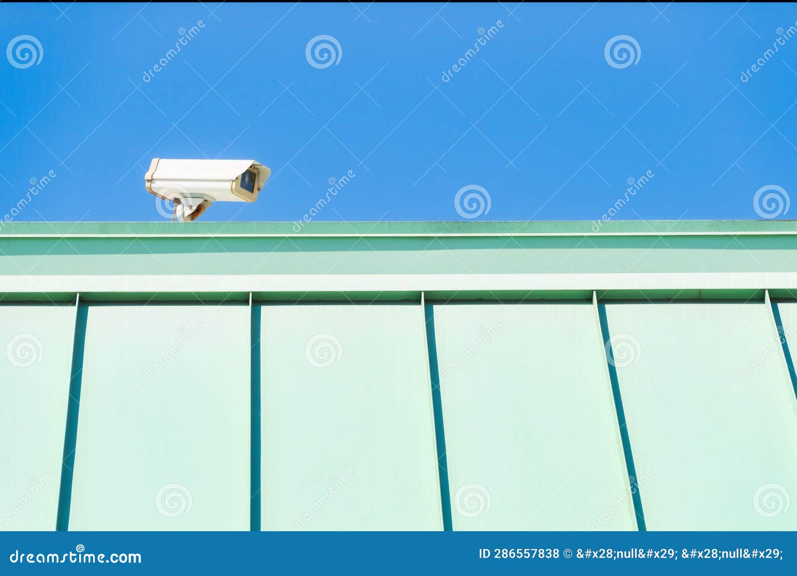 Security Camera on Left Side of Green Roof in Bright Sunlight Stock ...