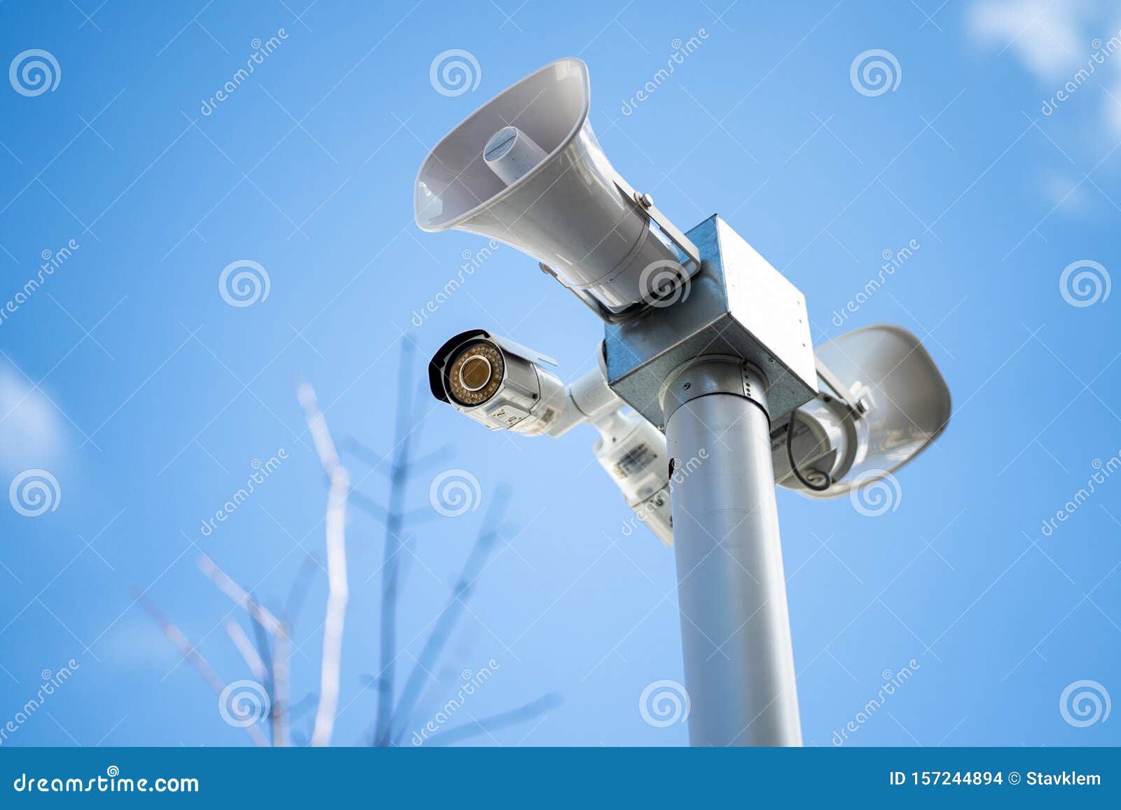 Security Camera with Loudspeakers and Megaphone on the Sky Background ...