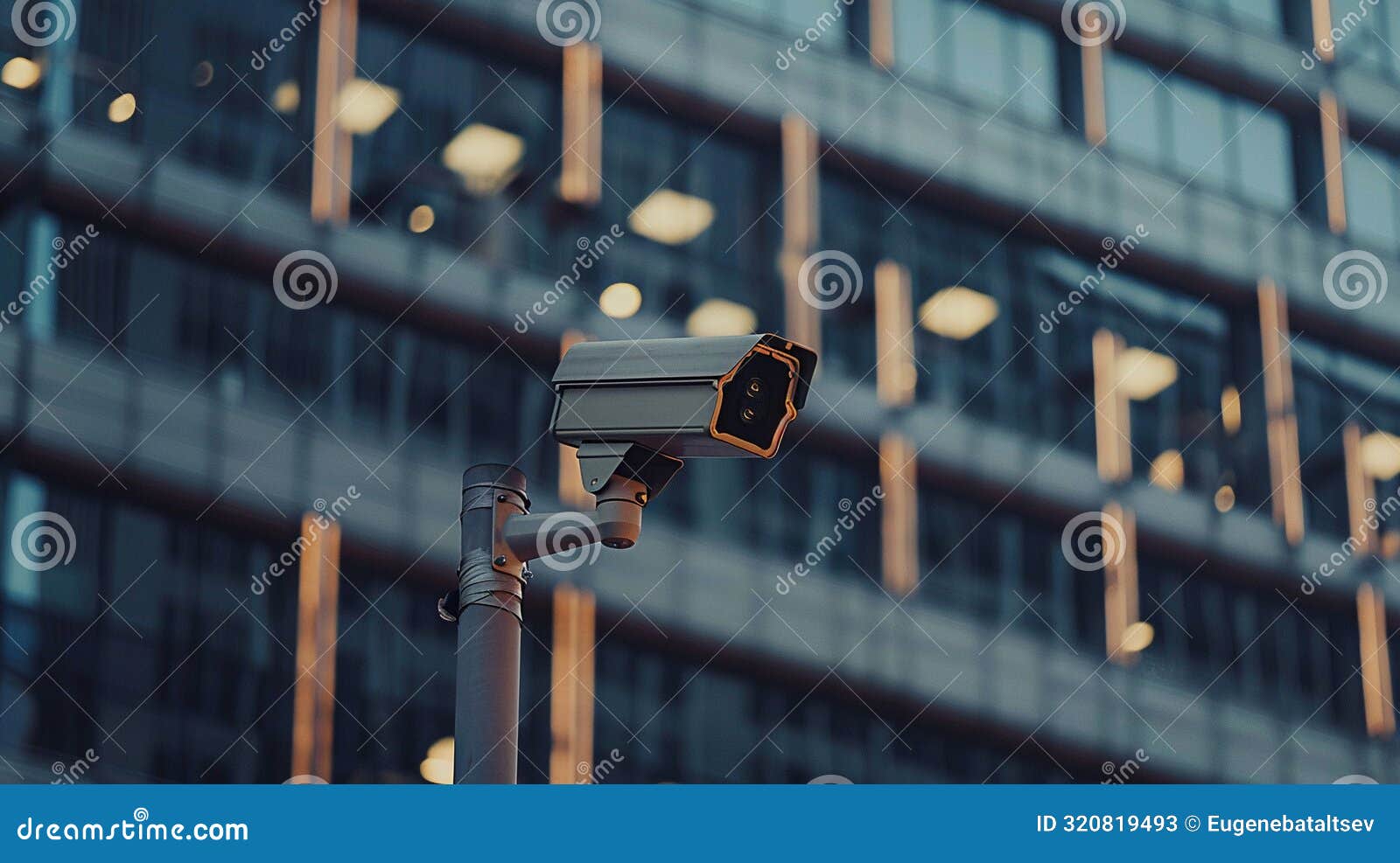Security Camera on Modern Building Facade with Rows of Windows and ...