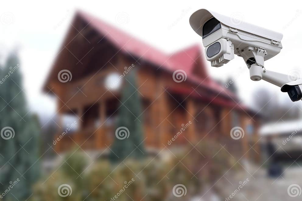 Security Camera and Private House on the Background. Stock Photo ...