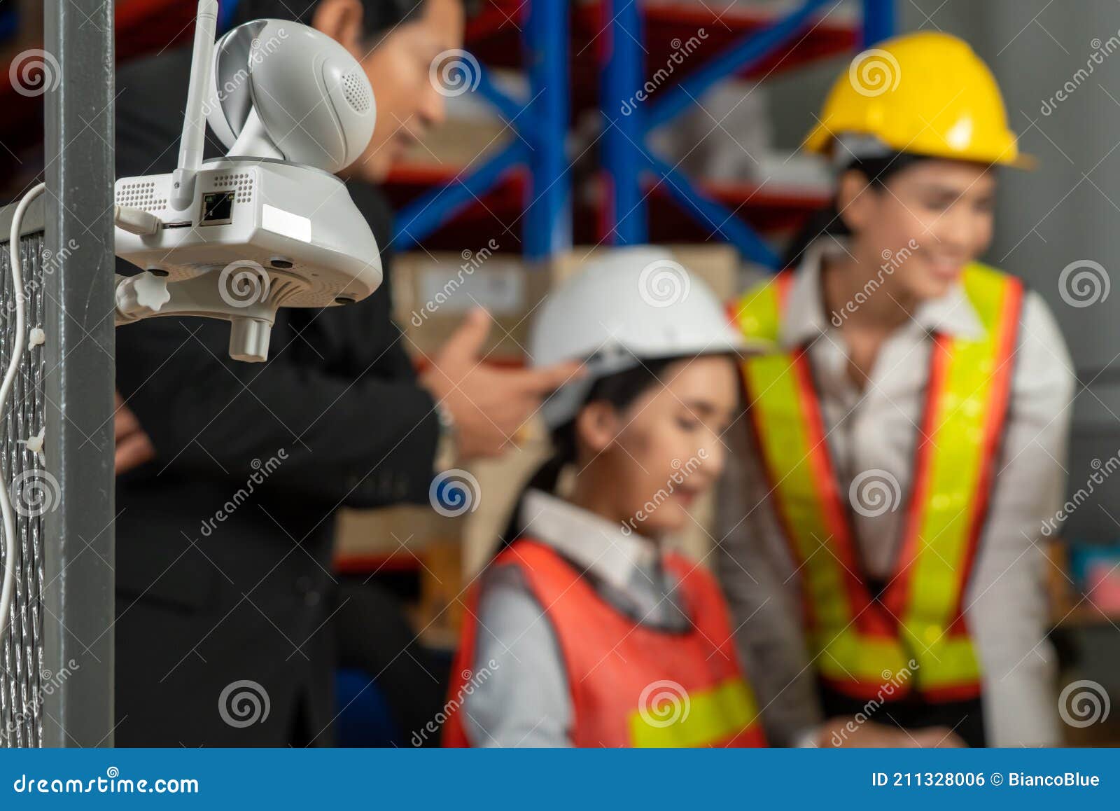 Security Camera Watching Warehouse Workers Working in the Storehouse ...