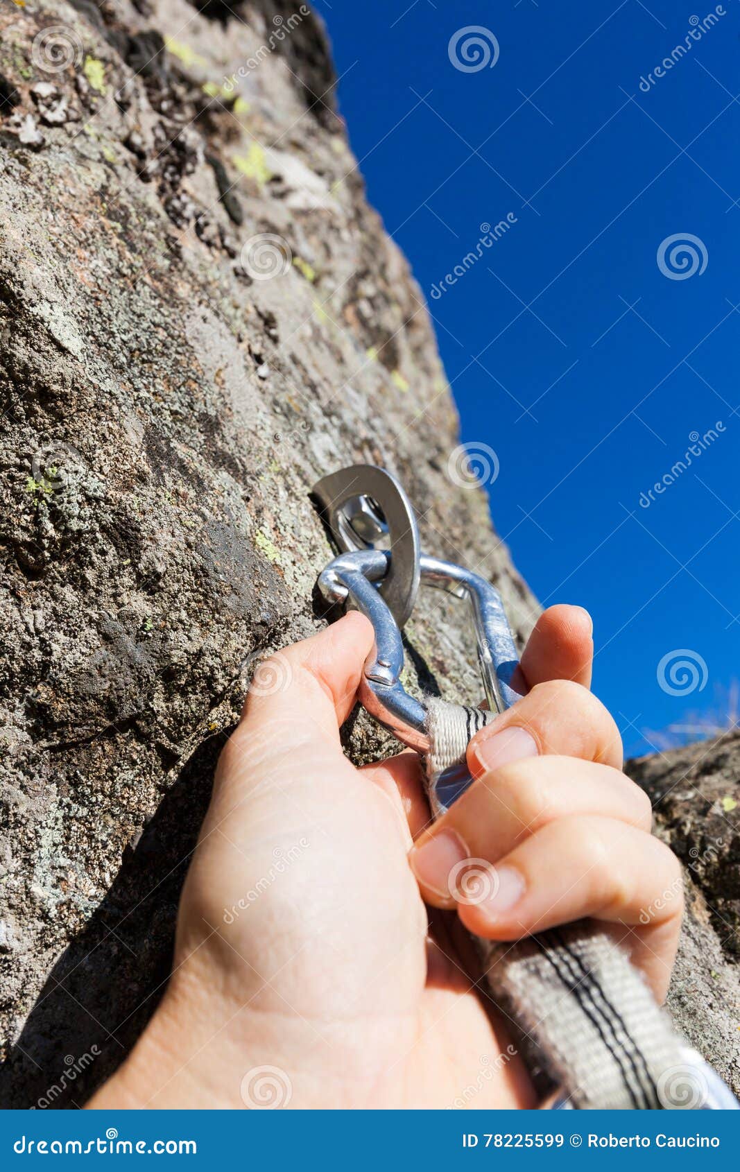 Security Concept: Climber Inserts a Quick-draw in Anchor on Rock Stock ...