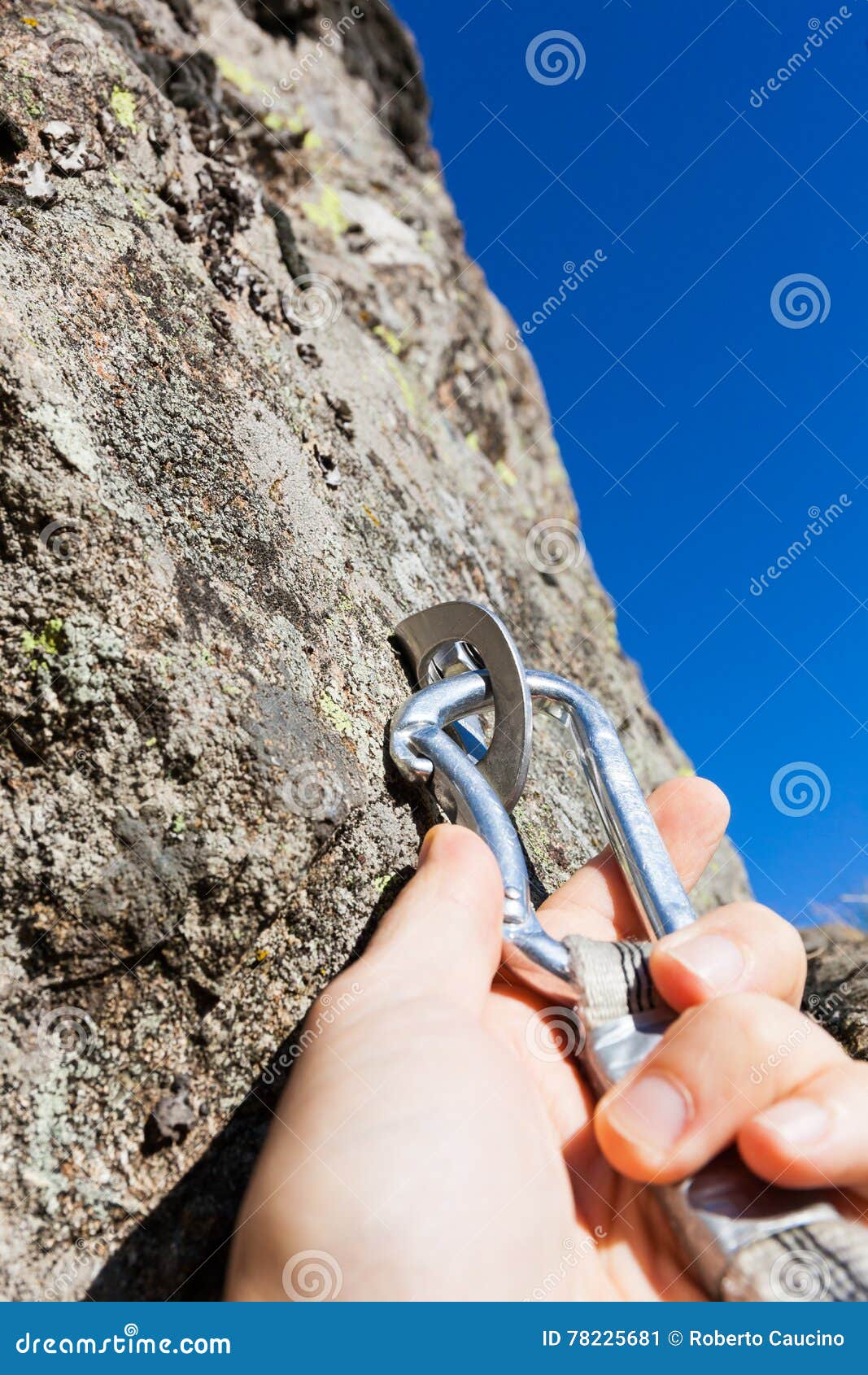 Security Concept: Climber Inserts a Quick-draw in Anchor on Rock Stock ...