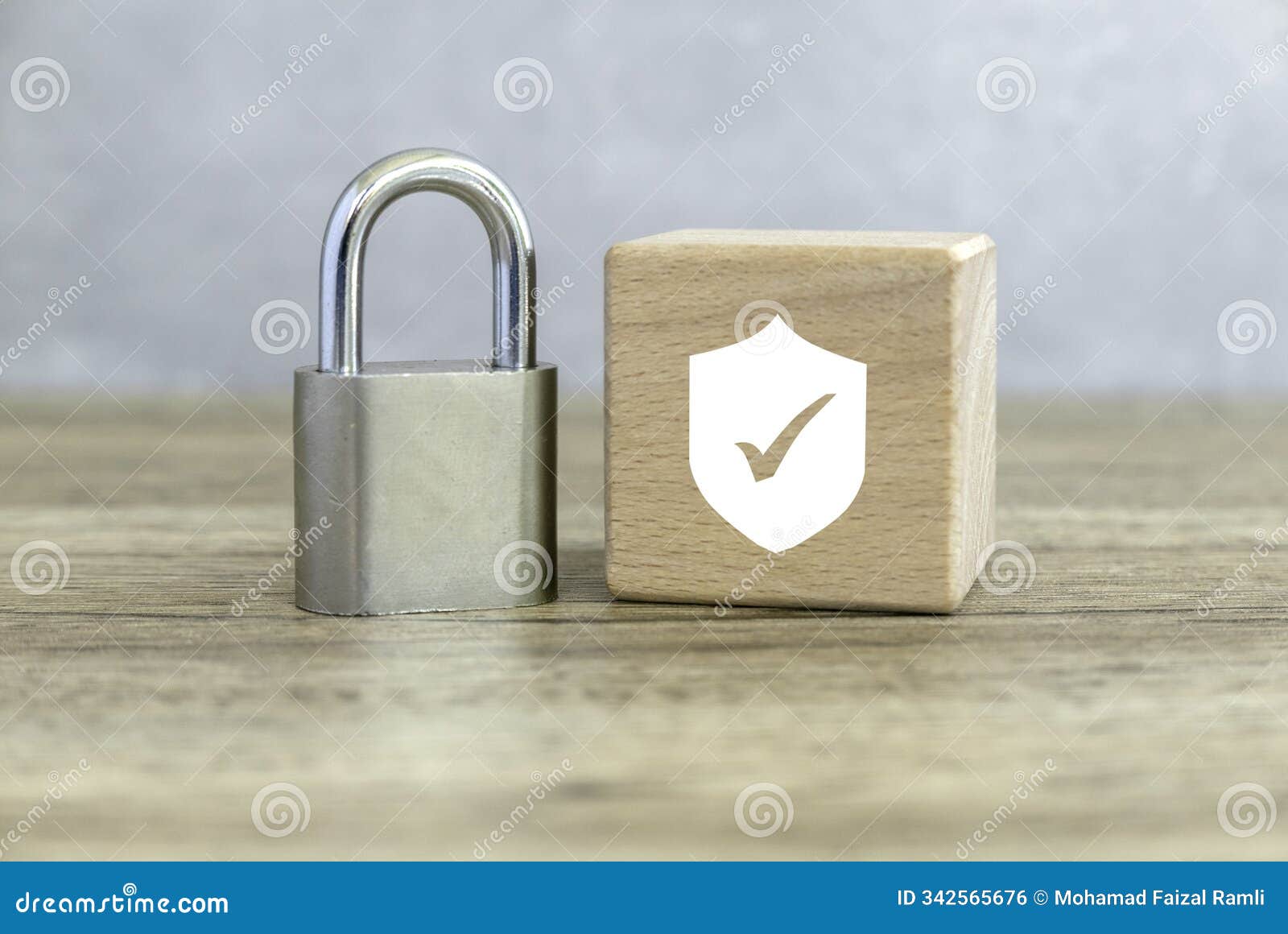 Security Concept: Metal Padlock and Wooden Block with Shield and ...