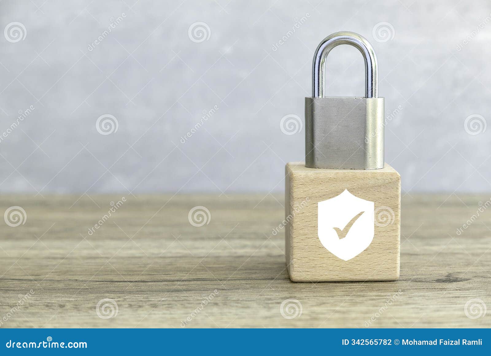 Security Concept: Metal Padlock and Wooden Block with Shield and ...
