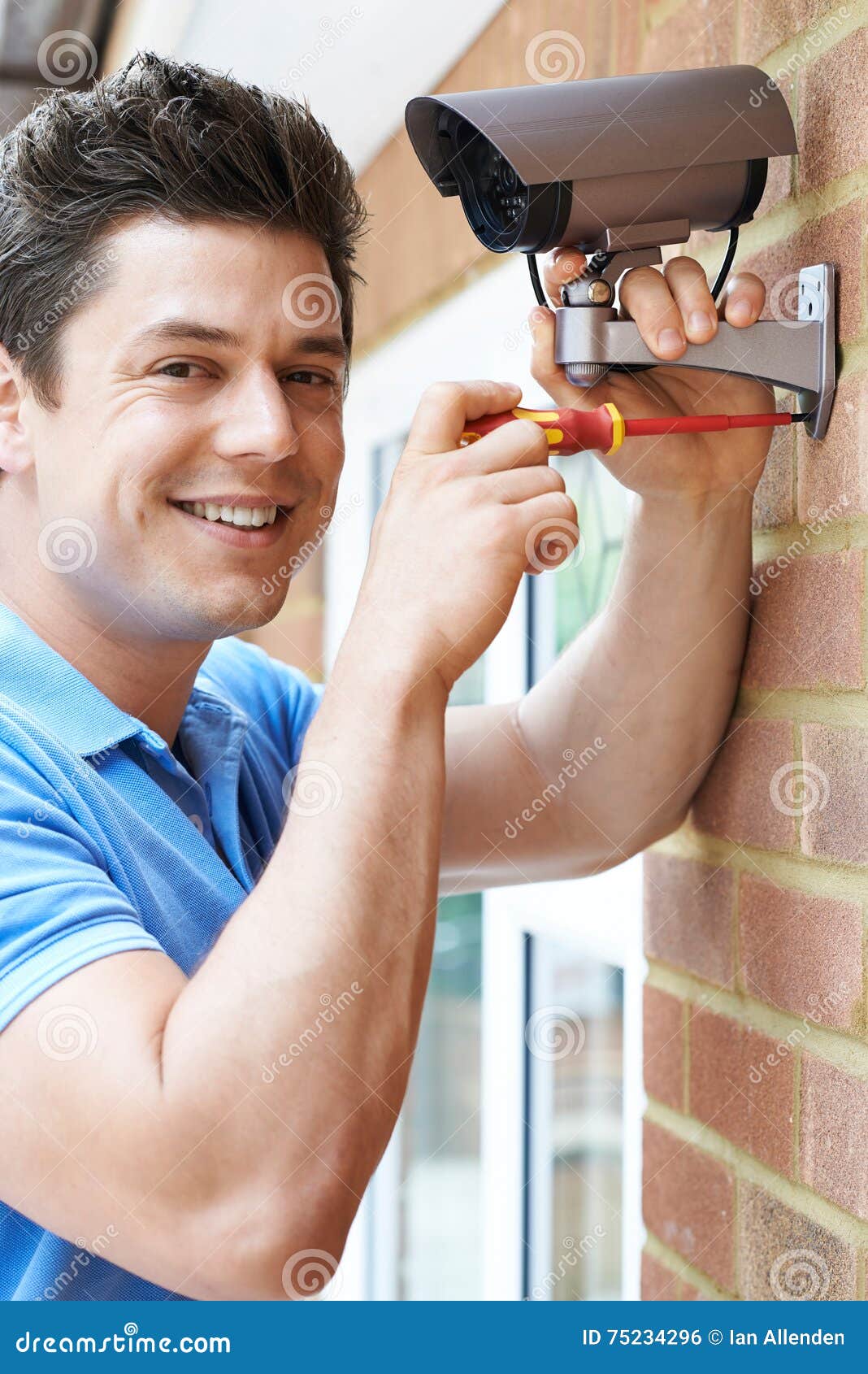 Security Consultant Fitting Camera To House Wall Stock Photo - Image of ...
