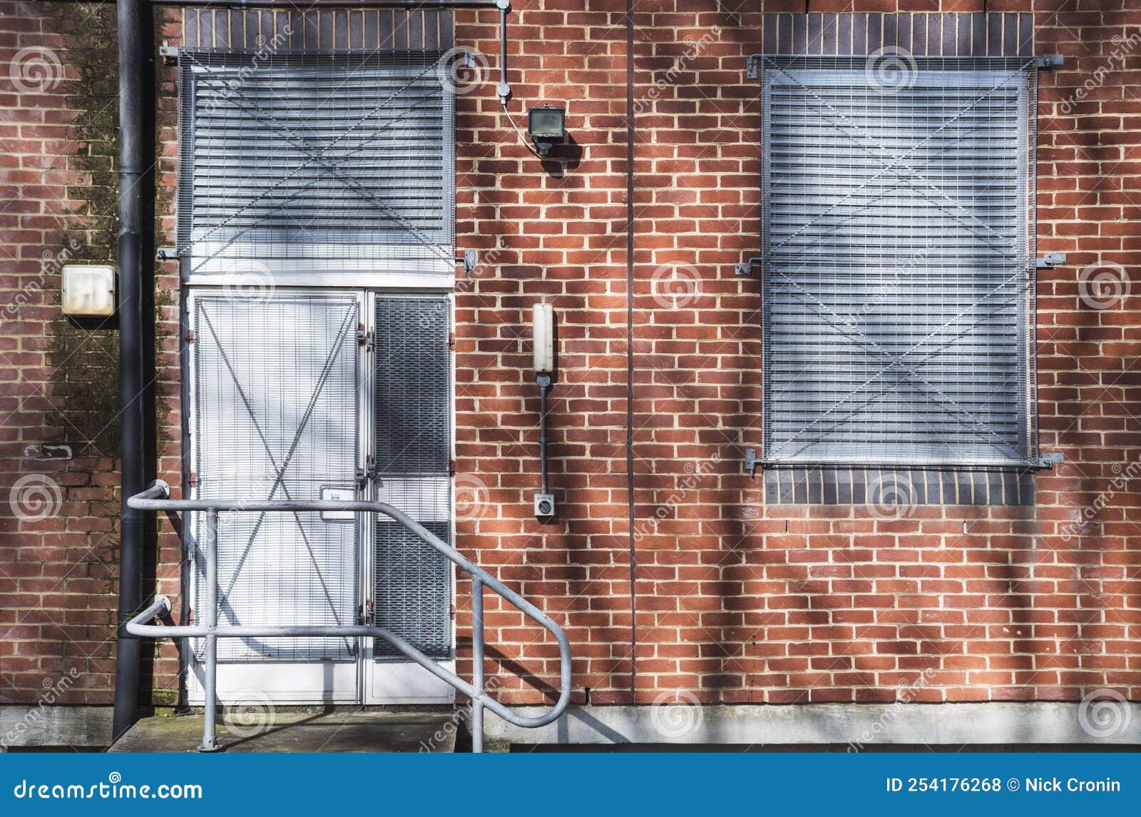 Security: Door and Windows Protected by Galvanised Metal Shutters ...
