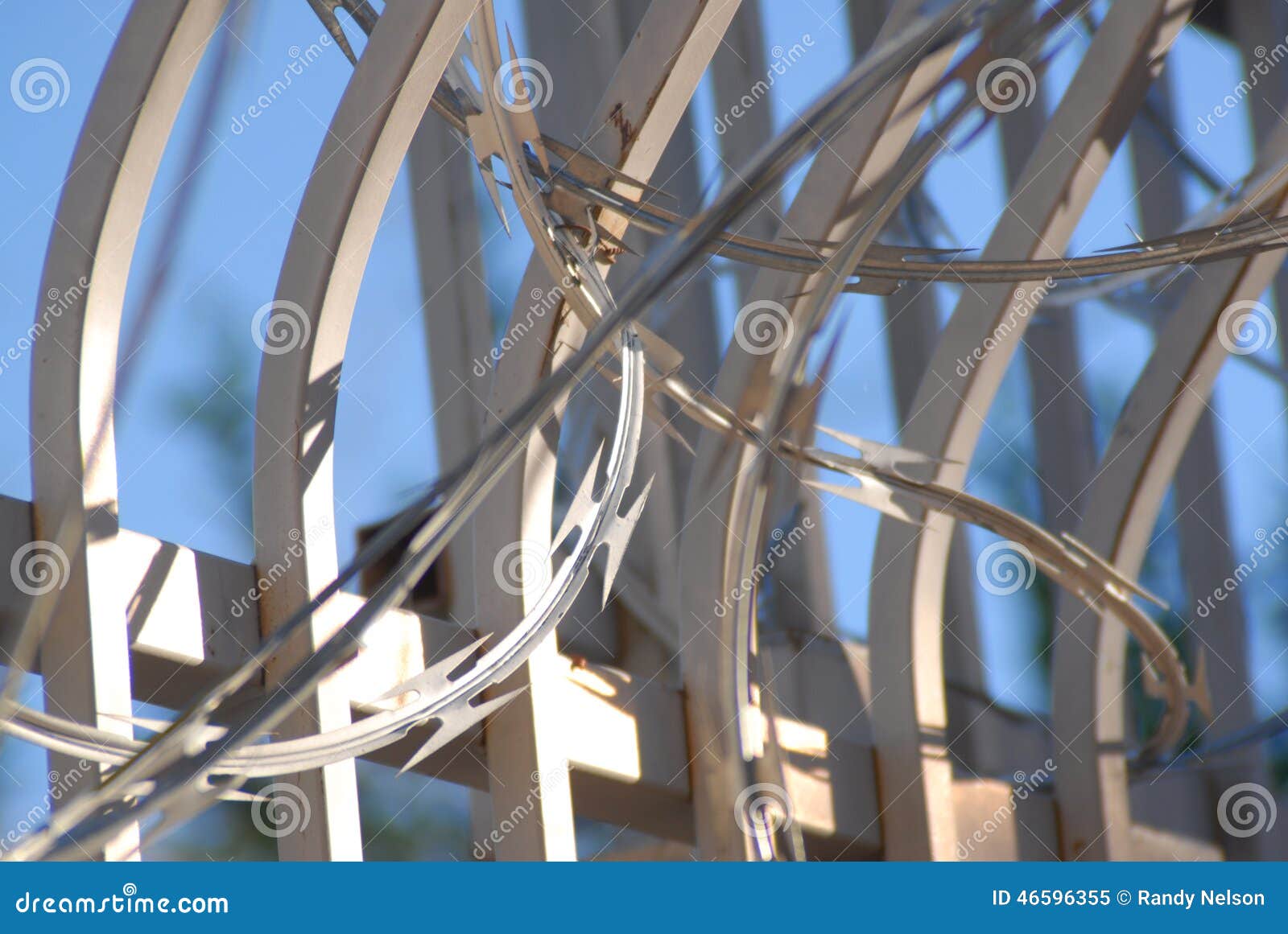 Security Fence with Razor Wire Blue Sky Upclose Stock Image - Image of ...