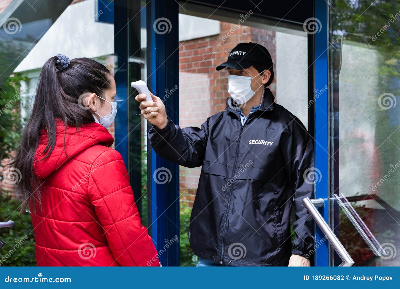 Security Guard Checking Temperature Stock Photo - Image of medical ...