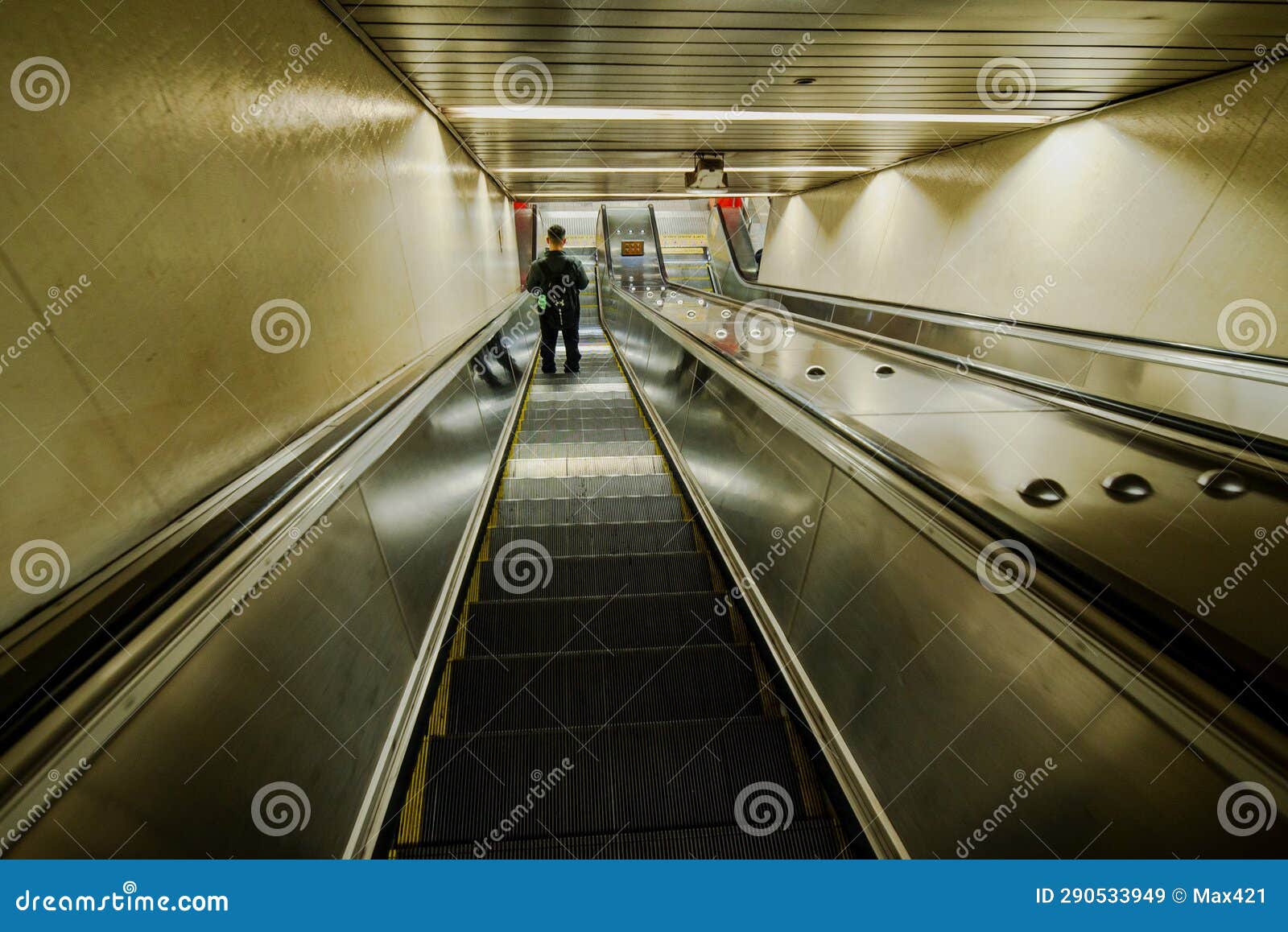 Security Guard on Escalator at Train Station Editorial Stock Image ...