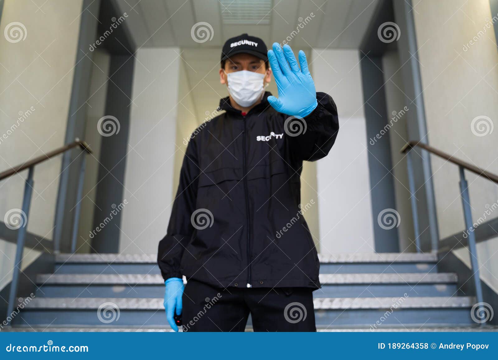 Security Guard in Face Mask Making Stop Gesture Stock Photo - Image of ...