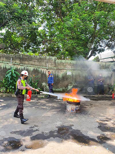 A Security Guard is Fighting a Fire Editorial Photography - Image of ...
