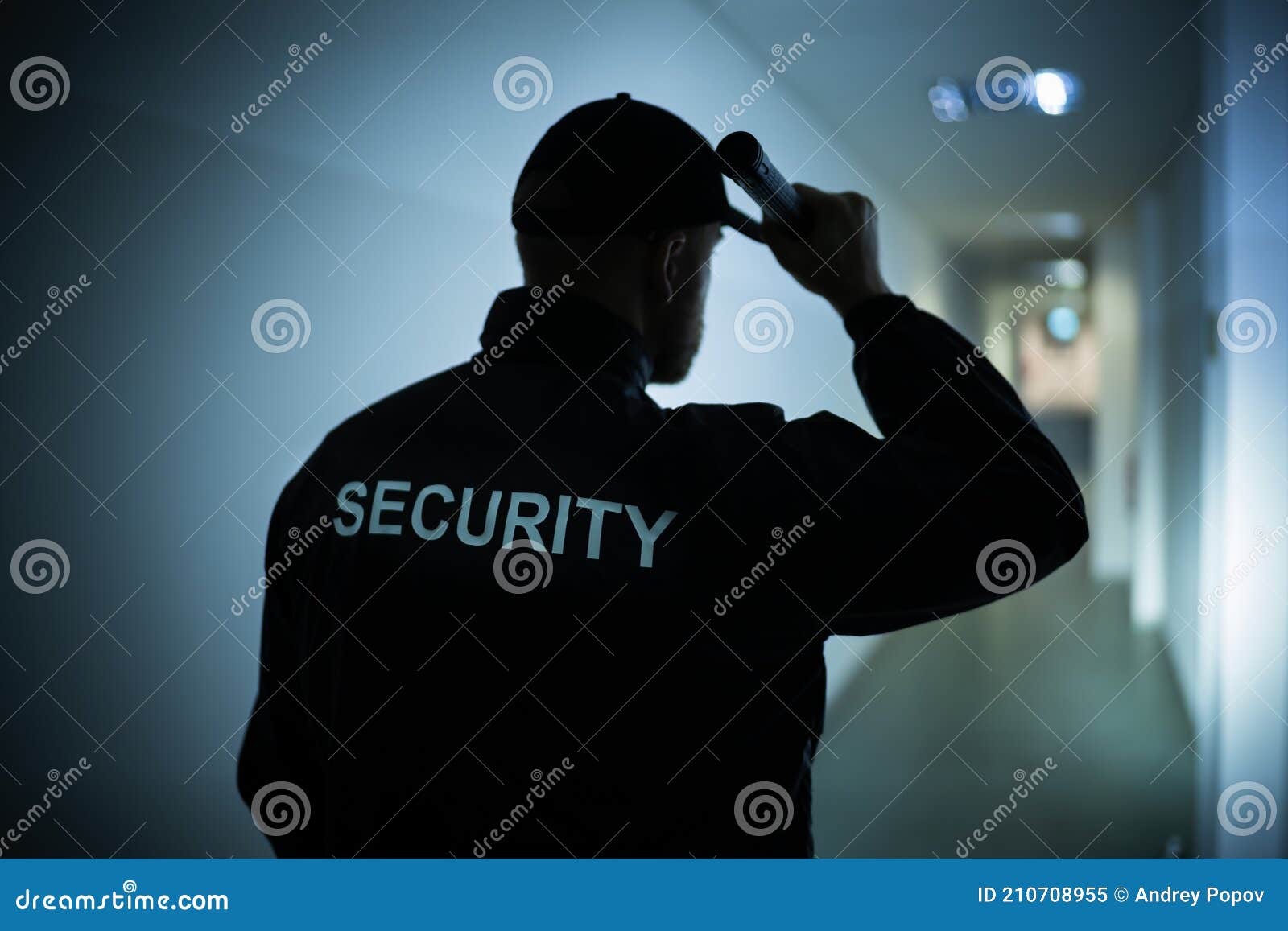 Security Guard with Flashlight in Building Corridor Stock Image - Image ...