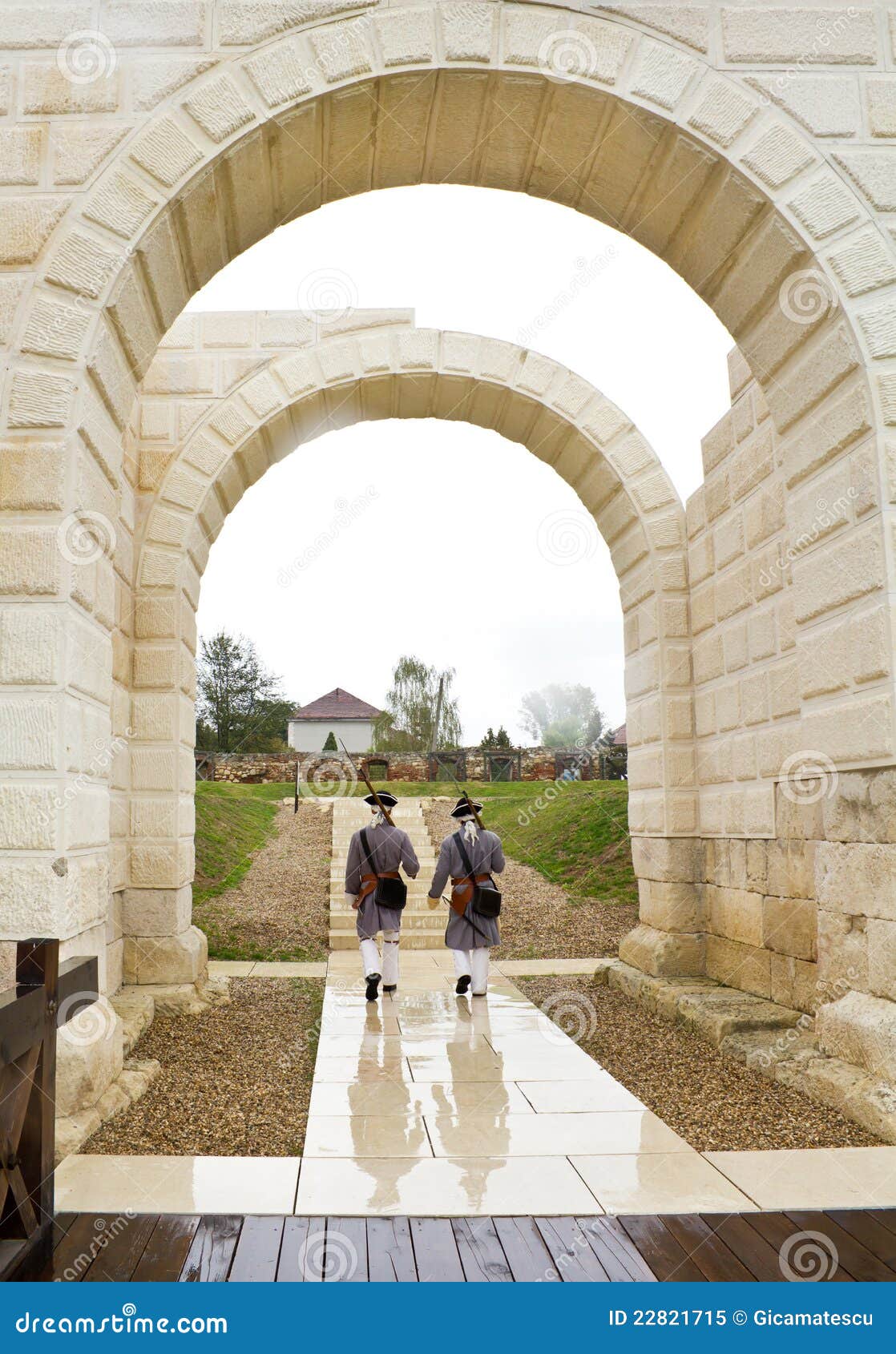 A Security Guard Sitting With The Decaying Decorated Walls In The ...