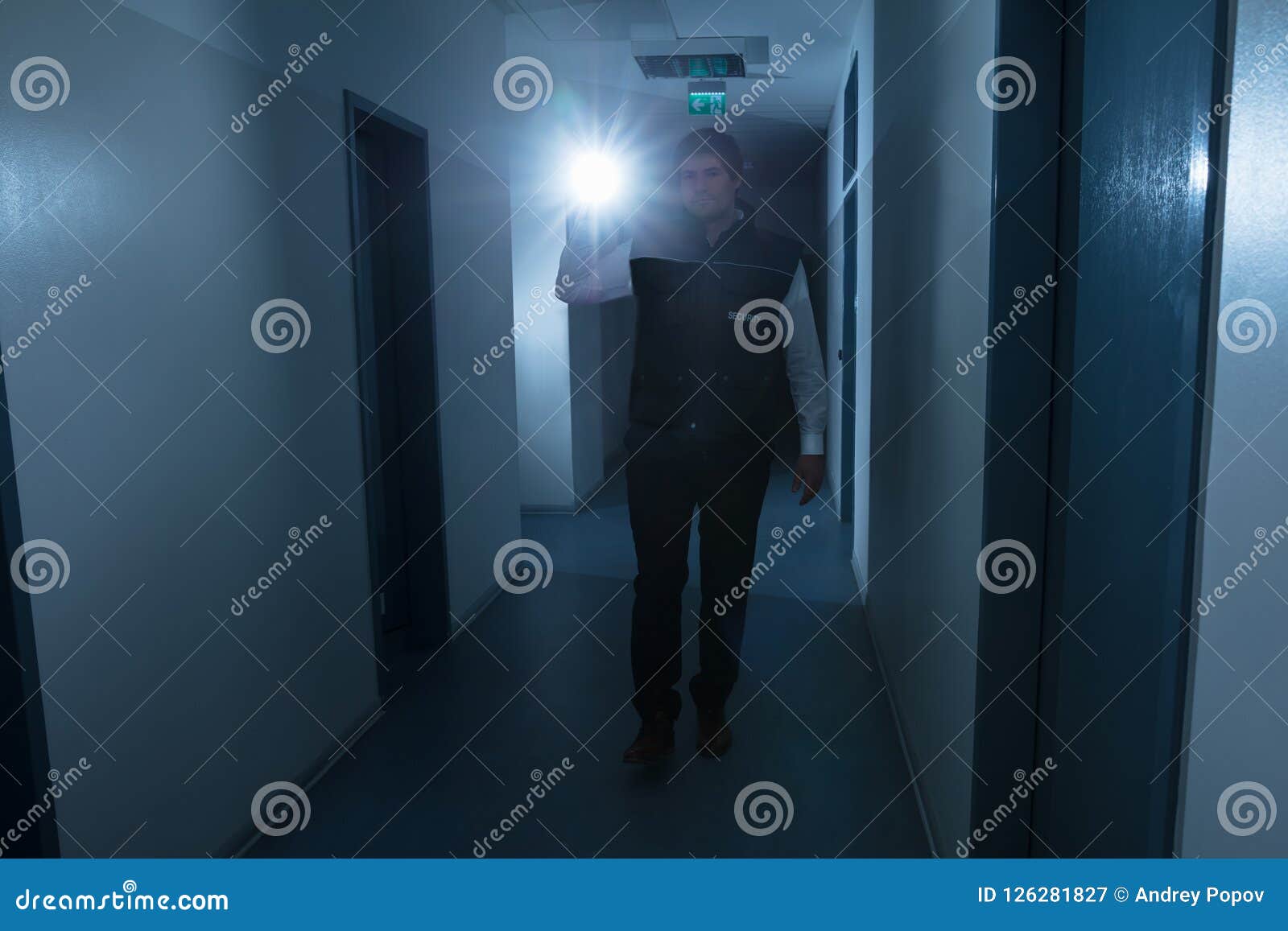 Security Guard Holding Flashlight Stock Image - Image of corridor ...