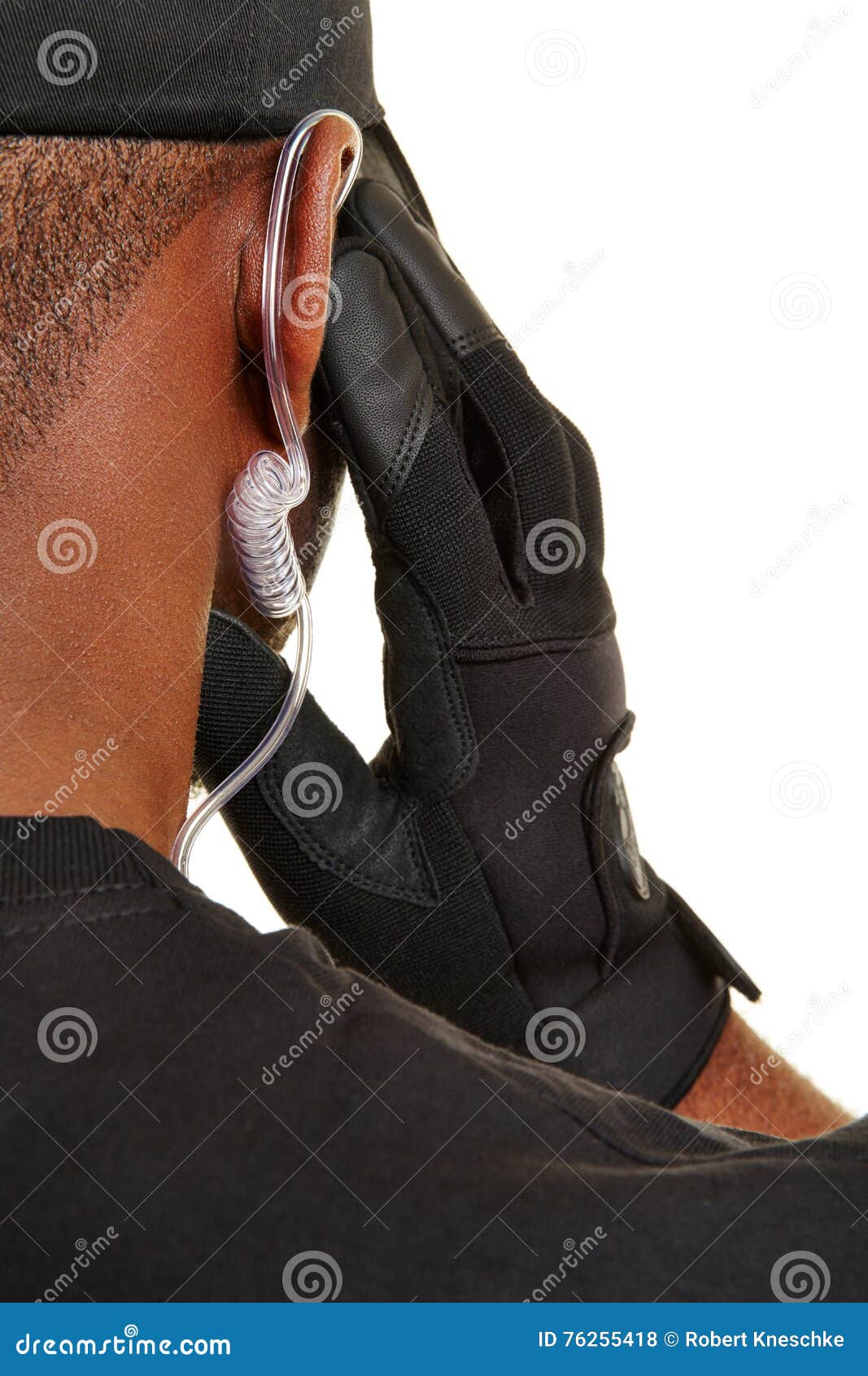 Security Guard Holding Hand To His Ear Stock Photo - Image of property ...