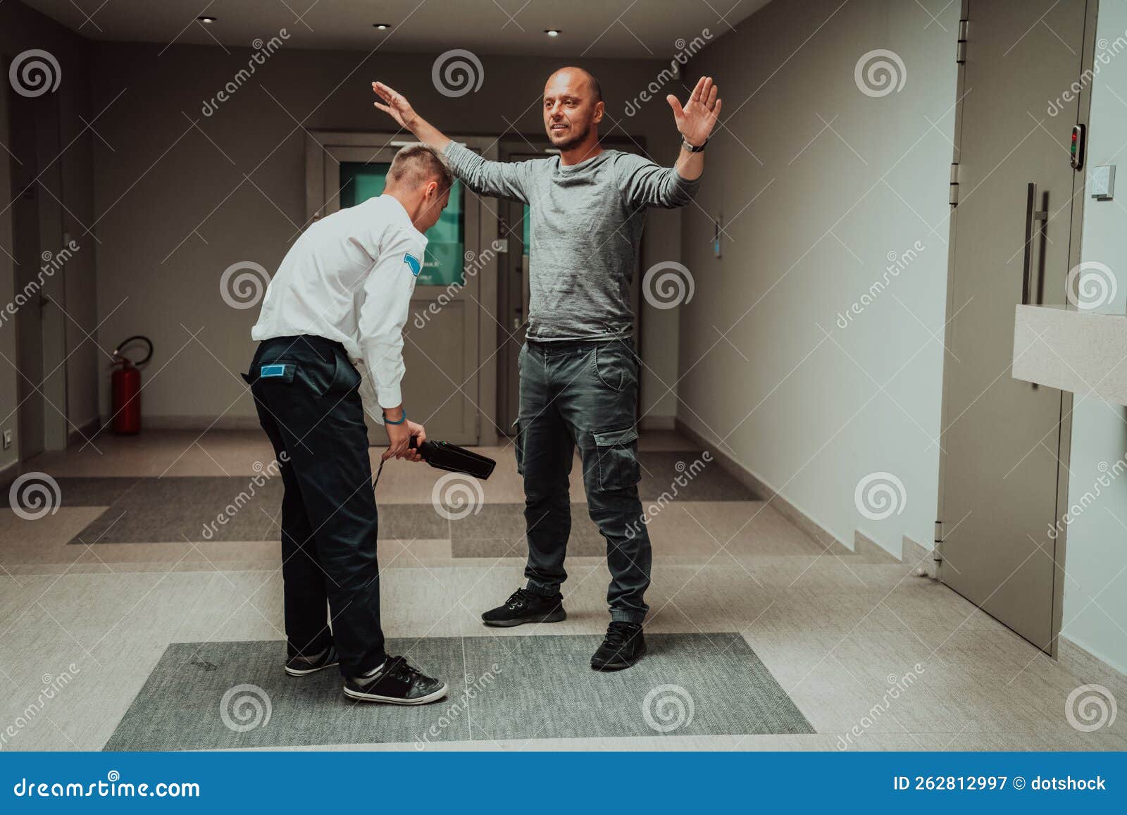 Security Guard Making Body Searching Procedure on Man for Finding ...