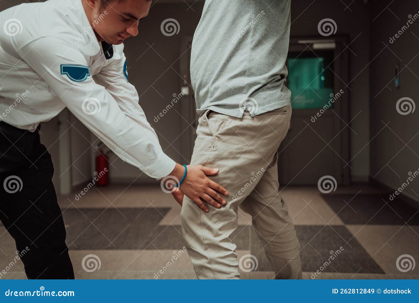 Security Guard Making Body Searching Procedure on Man for Finding ...