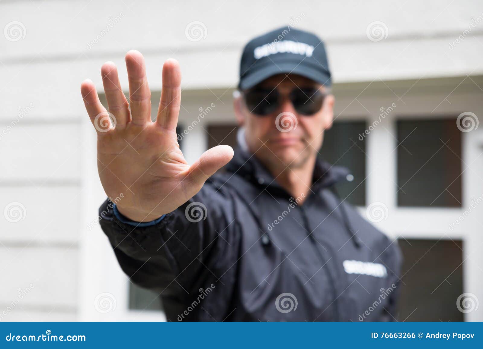 Security Guard Making Stop Gesture Outside Building Stock Photo - Image ...