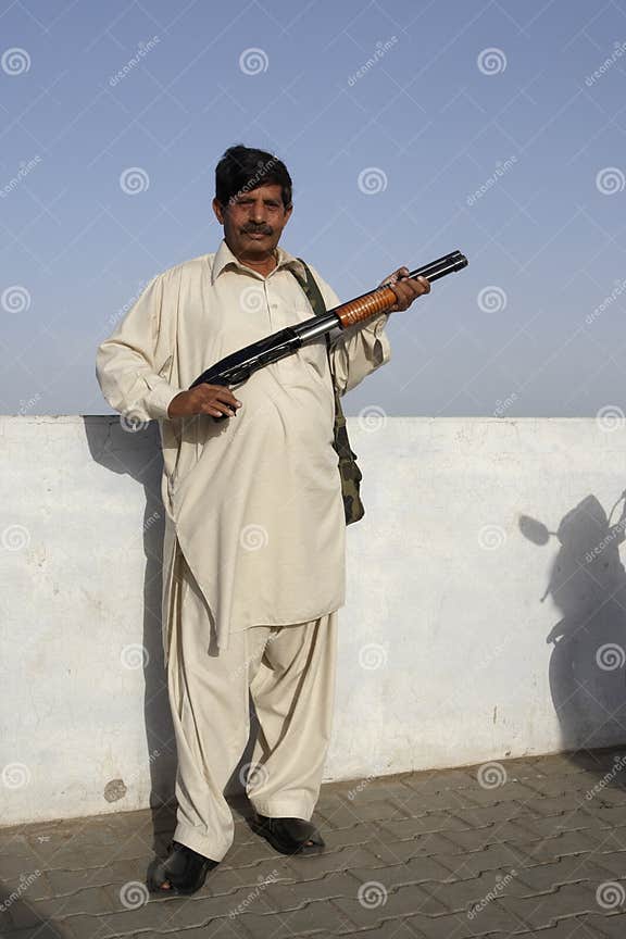Pakistani man with shotgun editorial stock photo. Image of diversity ...